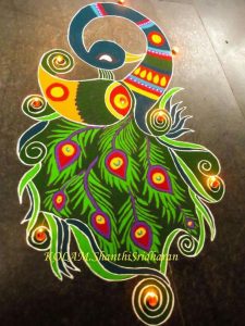 50 Admirable Peacock Rangoli designs that you can try - Wedandbeyond