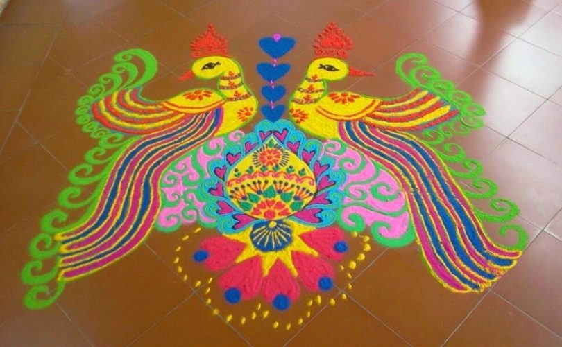 50 Admirable Peacock Rangoli designs that you can try - Wedandbeyond