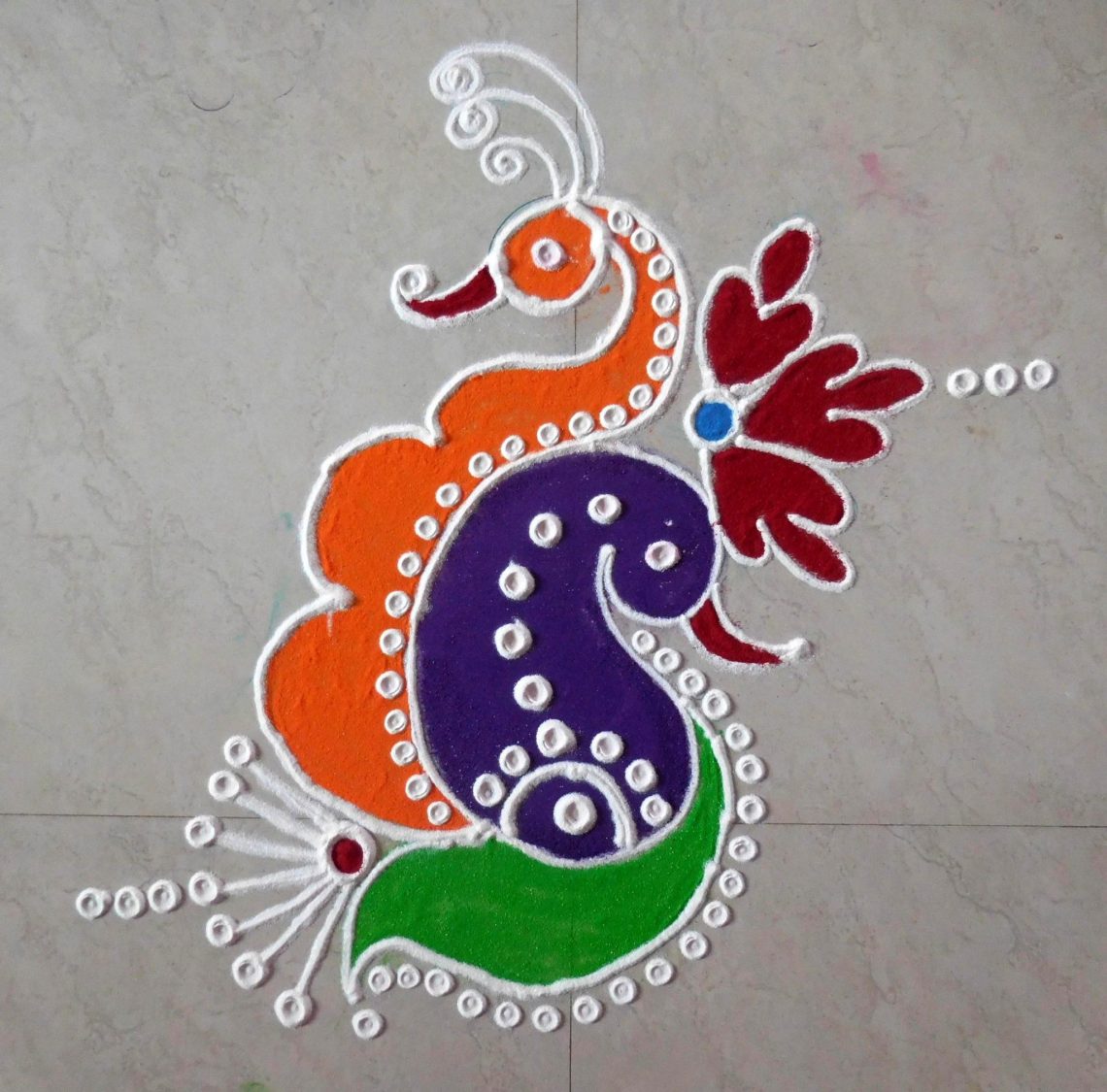 50 Admirable Peacock Rangoli designs that you can try - Wedandbeyond