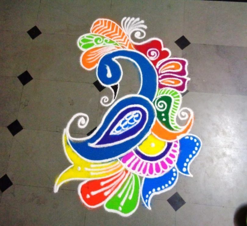 50 Admirable Peacock Rangoli designs that you can try - Wedandbeyond